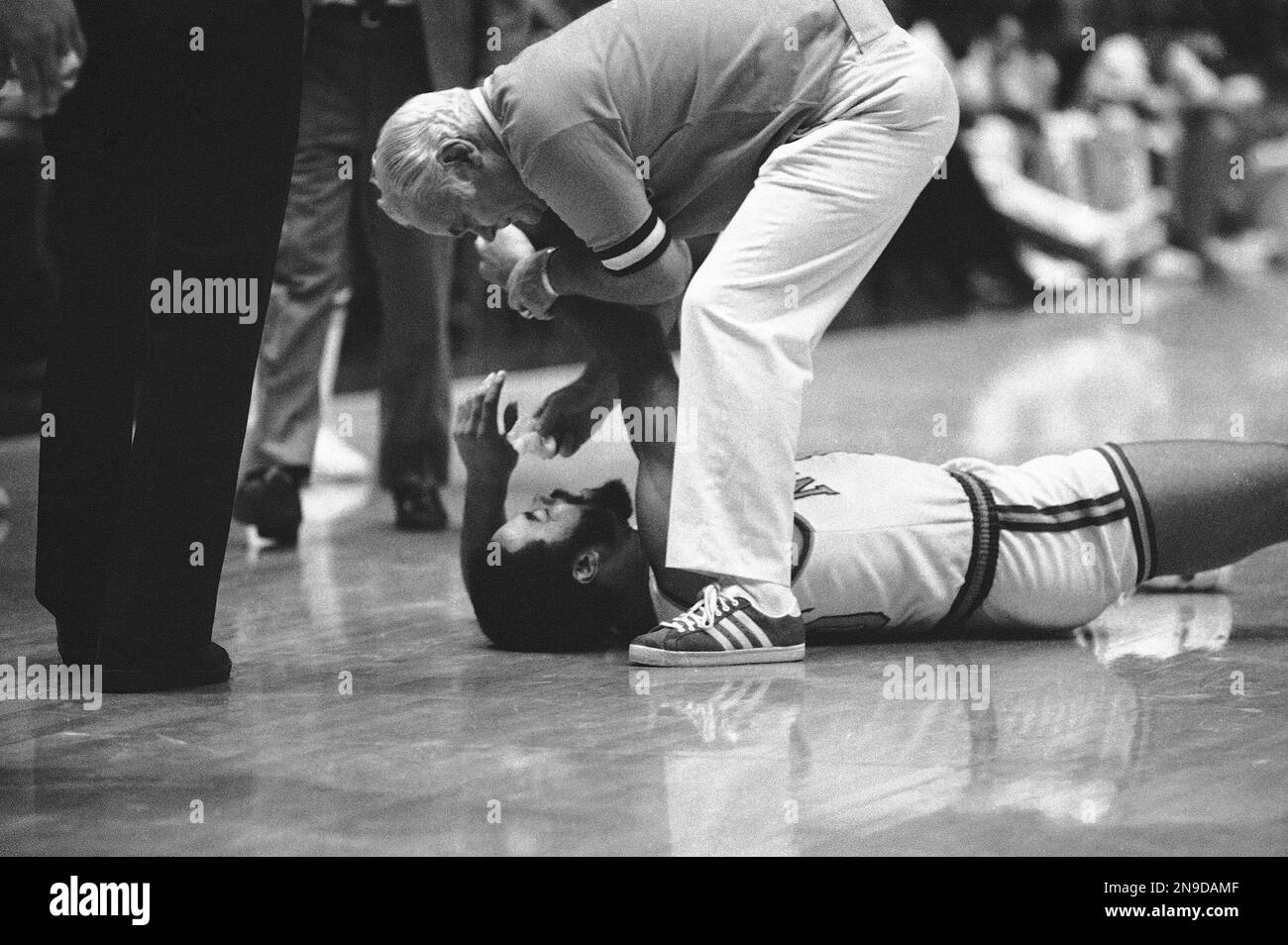 Walt Frazier of the New York Knicks lies on the floor of New York's ...