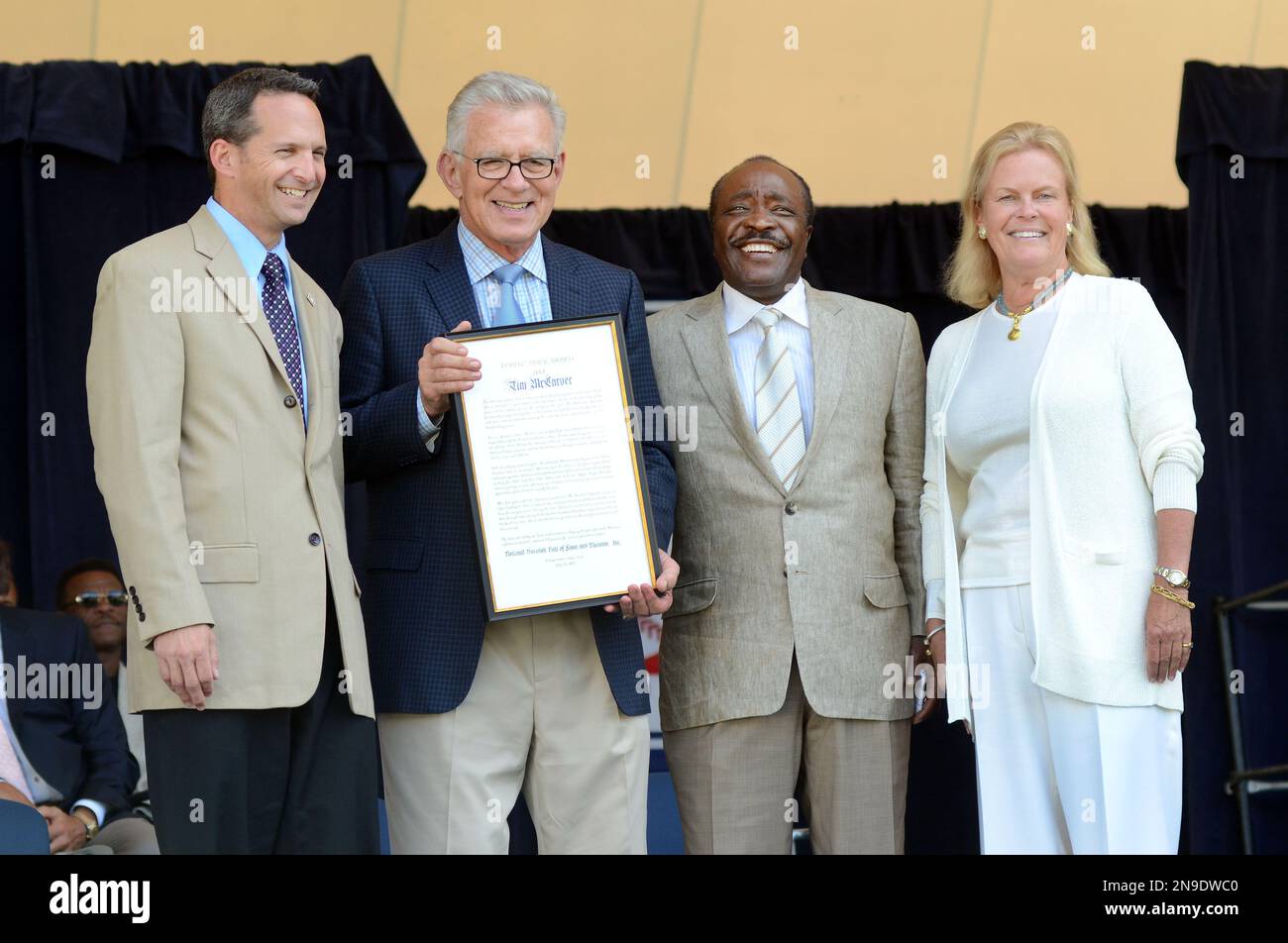 Tim McCarver, second from left, accepts the 2012 Ford C. Frick Award ...