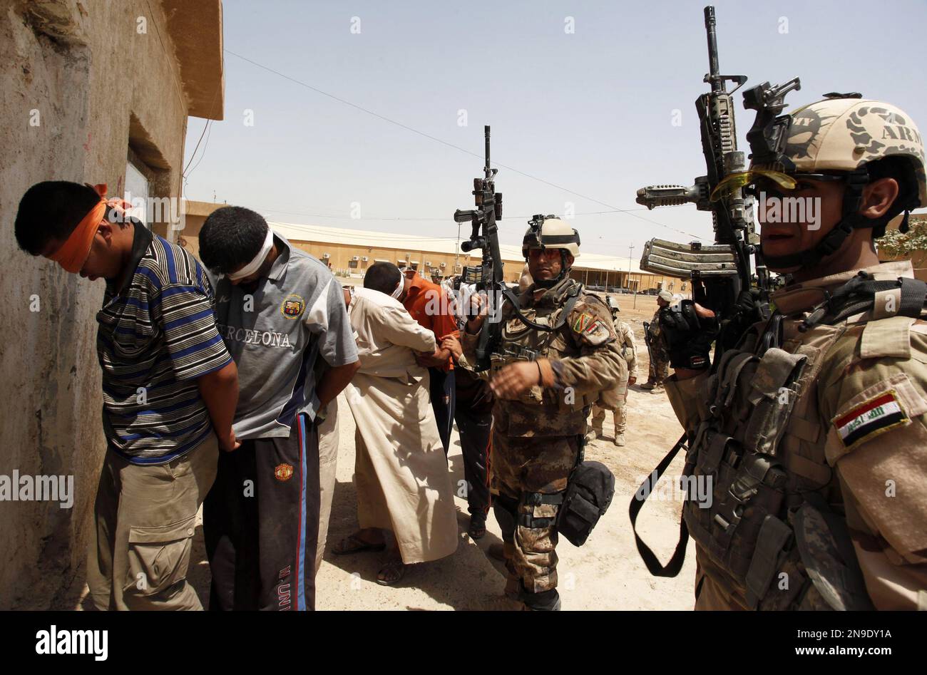 In this photo taken on Friday, July 20, 2012, blindfolded and ...