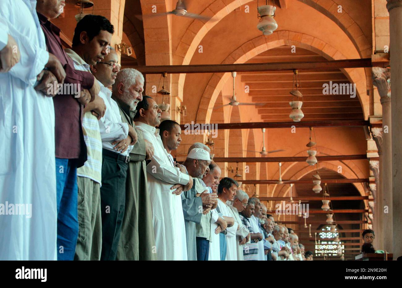 Egyptians pray at the Amr Ibn Al-As mosque in Cairo, Egypt, during the ...