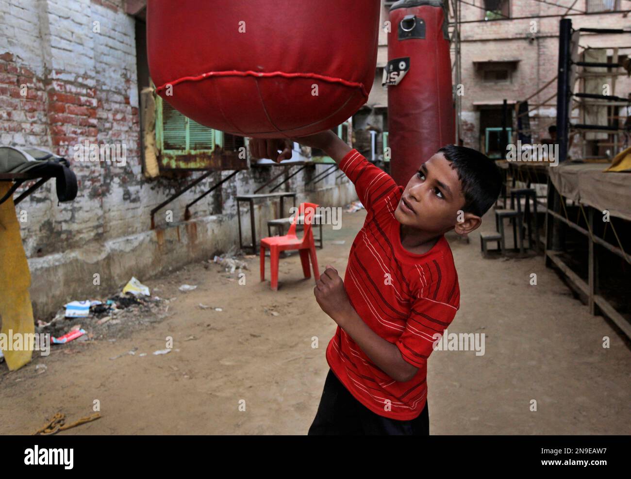 In this Thursday, July 12, 2012, photo, Rahul, a 10-year-old boxing ...