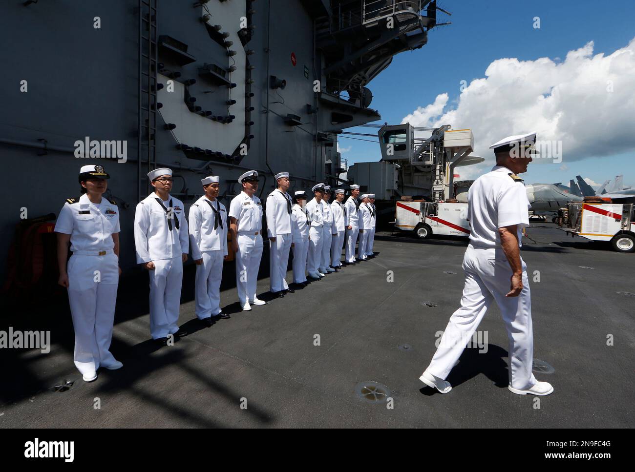 Captain David Lausman, commanding officer of the aircraft carrier USS ...