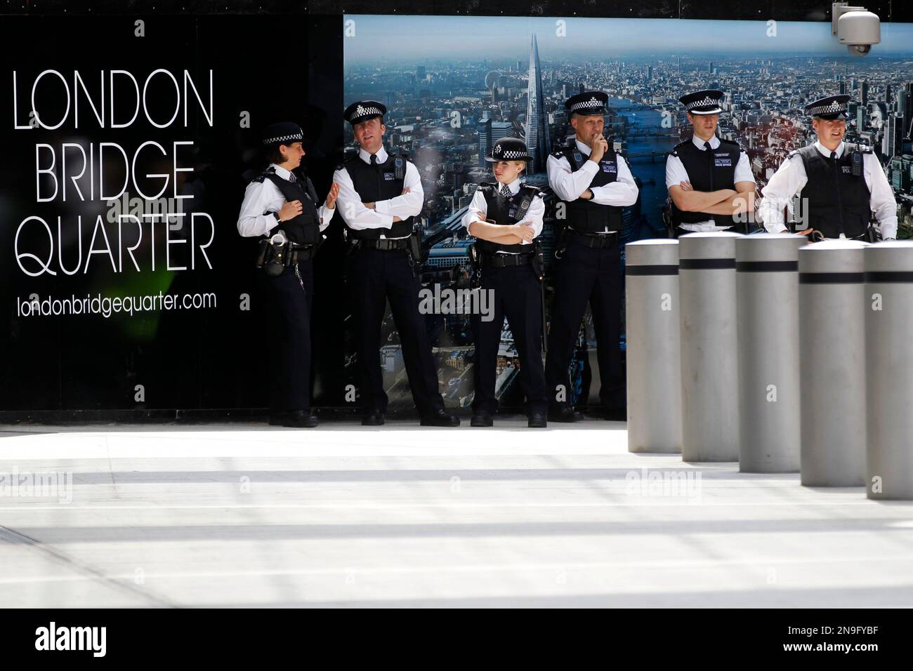Police officers stand guard outside the Shard in London during the ...