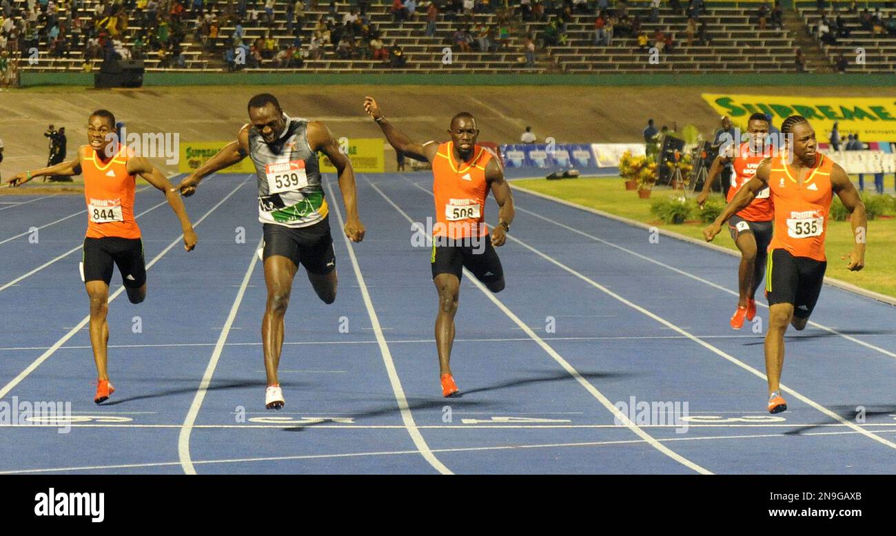 Sprinter Yohan Blake, far right, crosses the finish line ahead of world ...