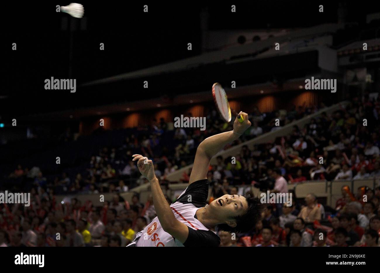 Thailand's Boonsak Ponsana returns a shot to Vietnam's Nguyen Tien Minh ...