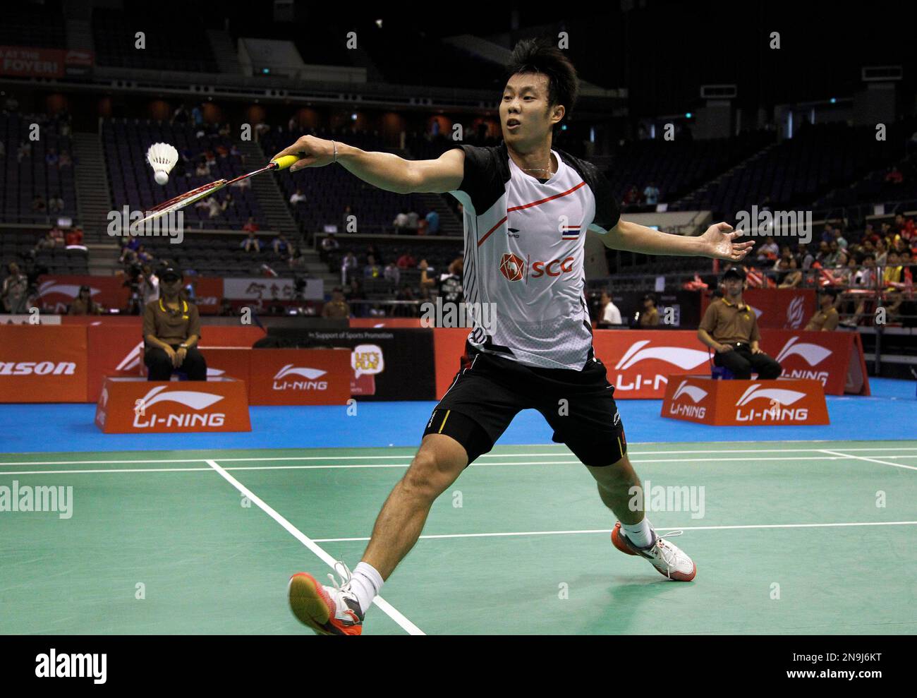 Thailand's Boonsak Ponsana returns a shot to Vietnam's Nguyen Tien Minh ...