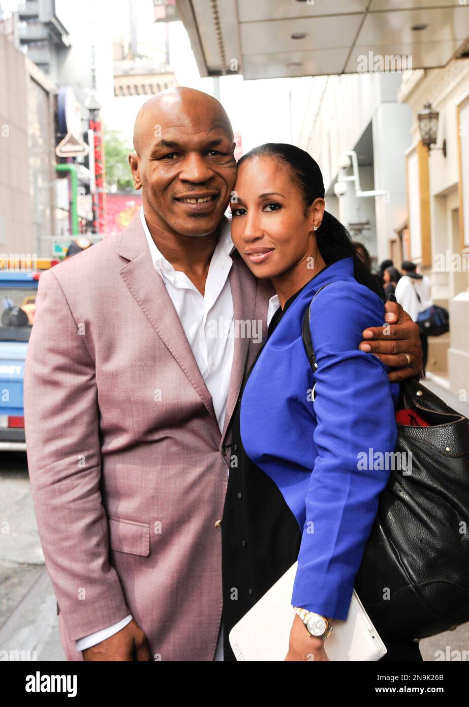 Former heavyweight boxer Mike Tyson and wife Kiki Tyson pose together ...