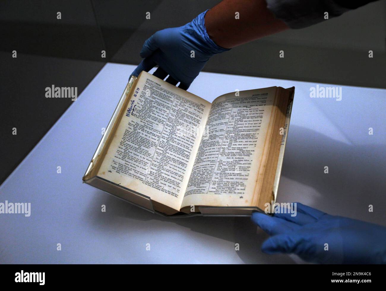 Becky Allan, project curator of the British Museum, holds an edition of ...