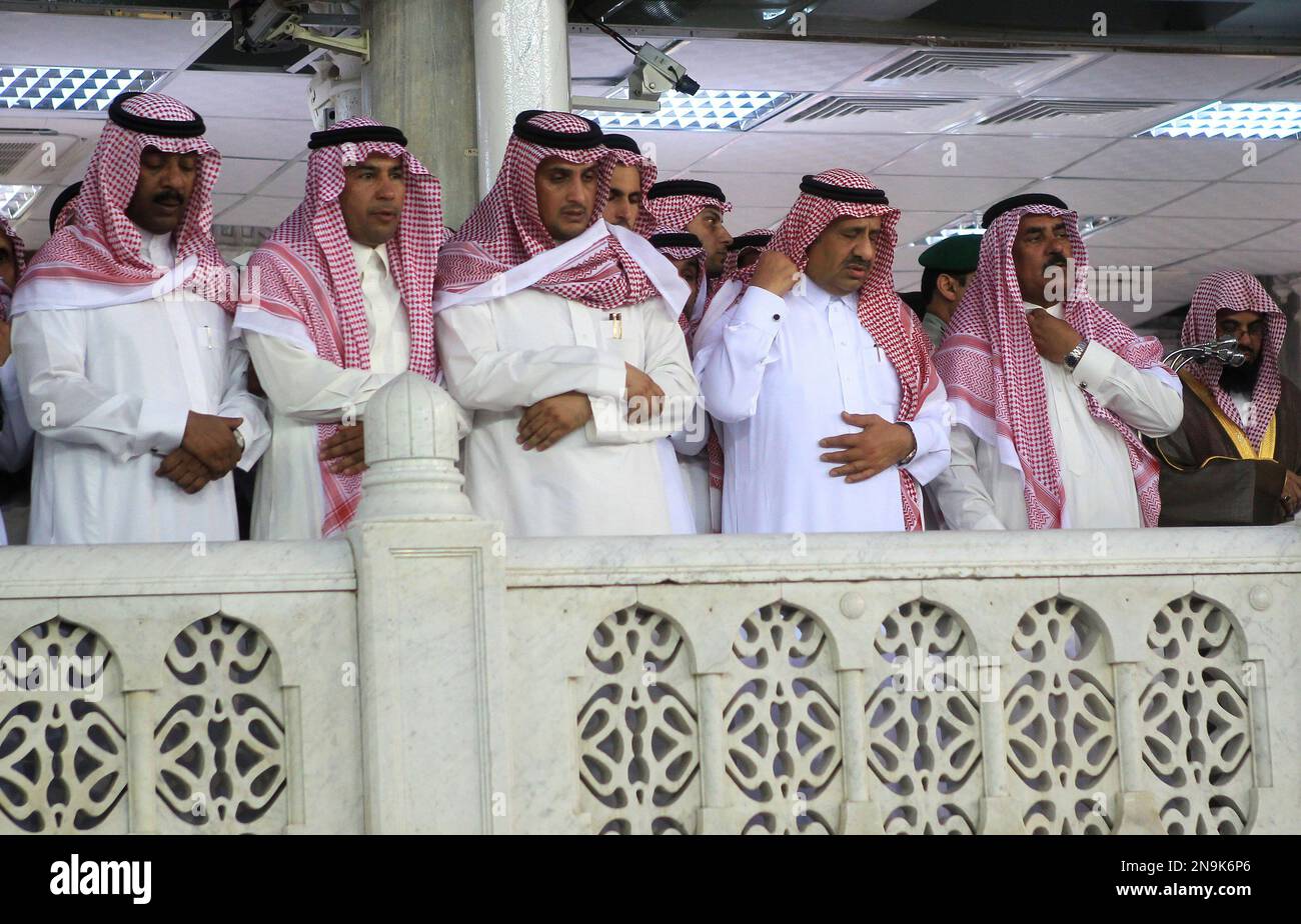 Relatives from the Saudi royal family pray during the funeral of the ...