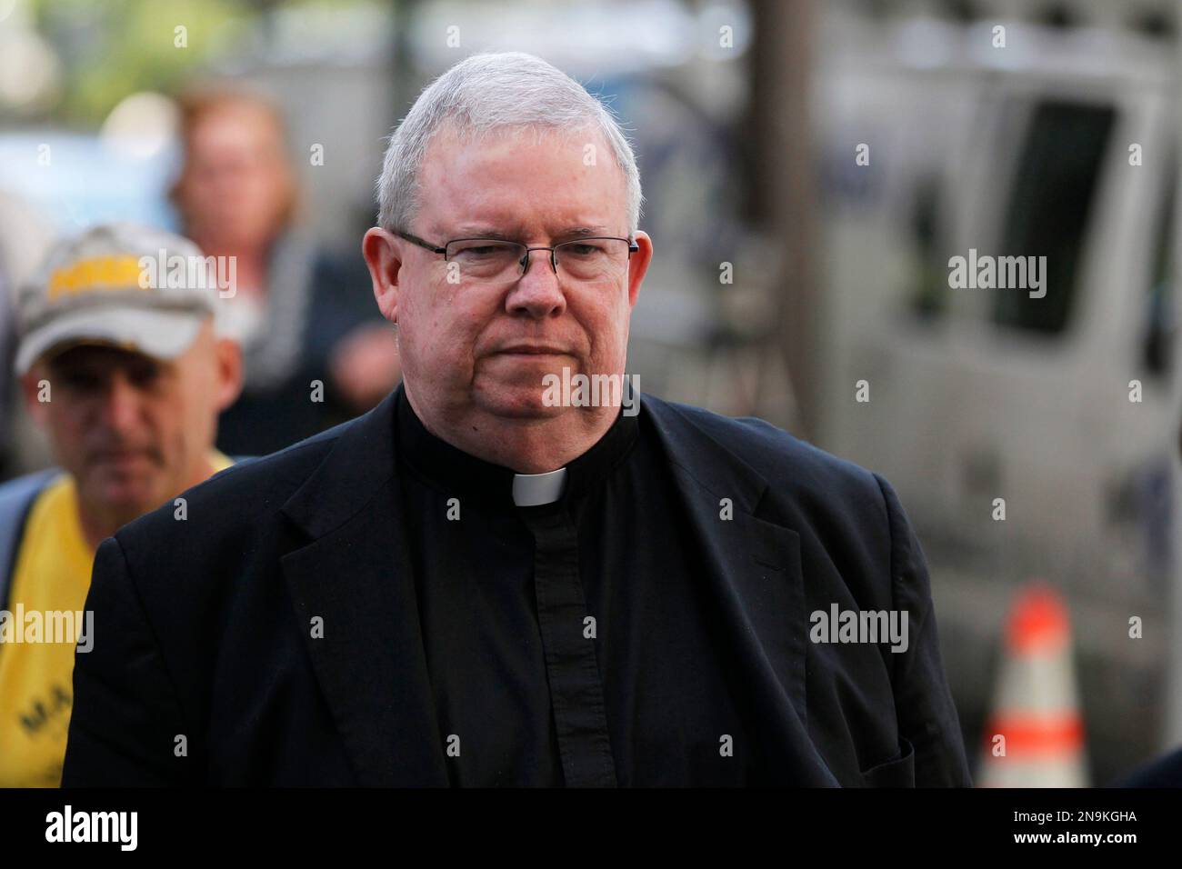 Monsignor William Lynn walks to the Criminal Justice Center, Friday ...