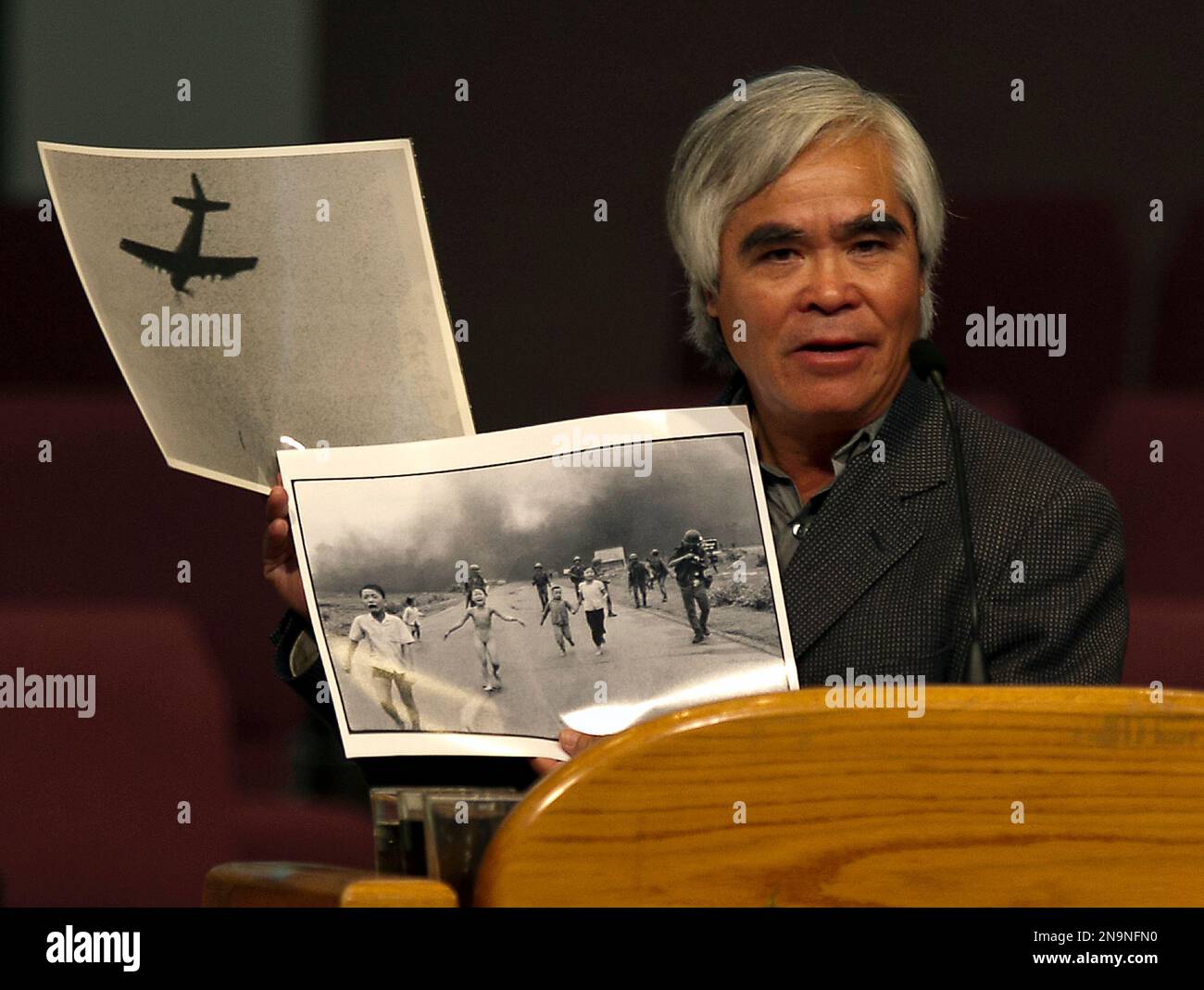 Associated Press staff photographer Nick Ut shows his famous photograph ...