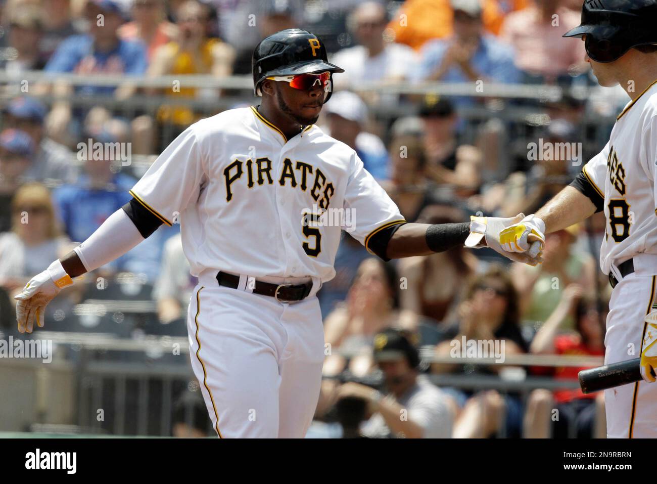 Pittsburgh Pirates' Josh Harrison (5) is greeted by teammate Neil ...