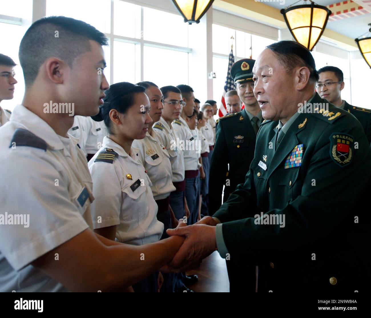 China's Minister of National Defense Gen. Liang Guanglie greets Cadet ...