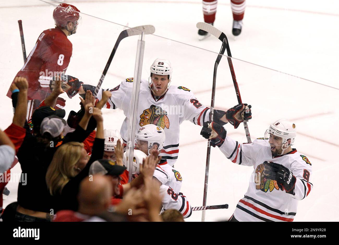 As Chicago Blackhawks fans cheer on their team from the stands ...