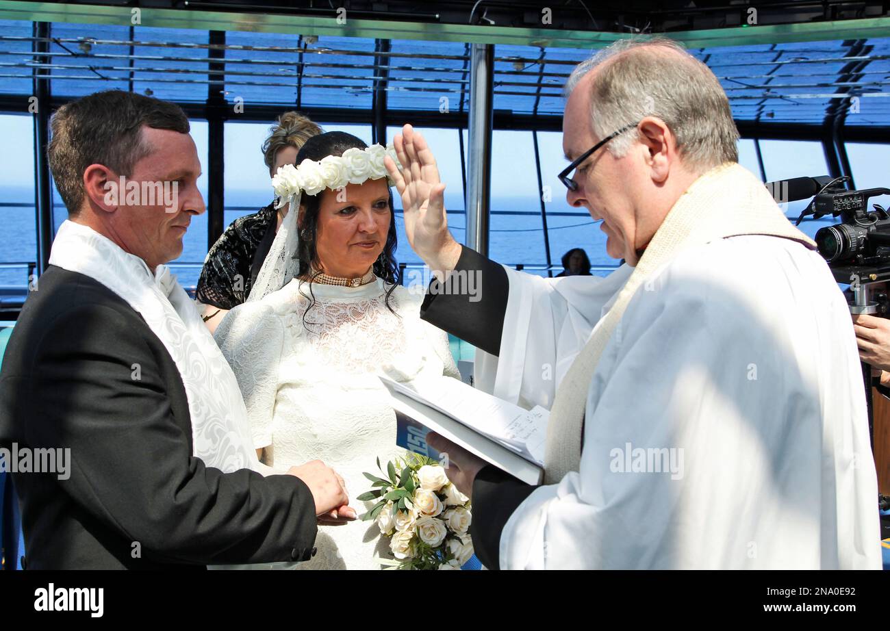 Rved. Canon Huw Mosford, right, blesses Derek Chambers and his wife ...
