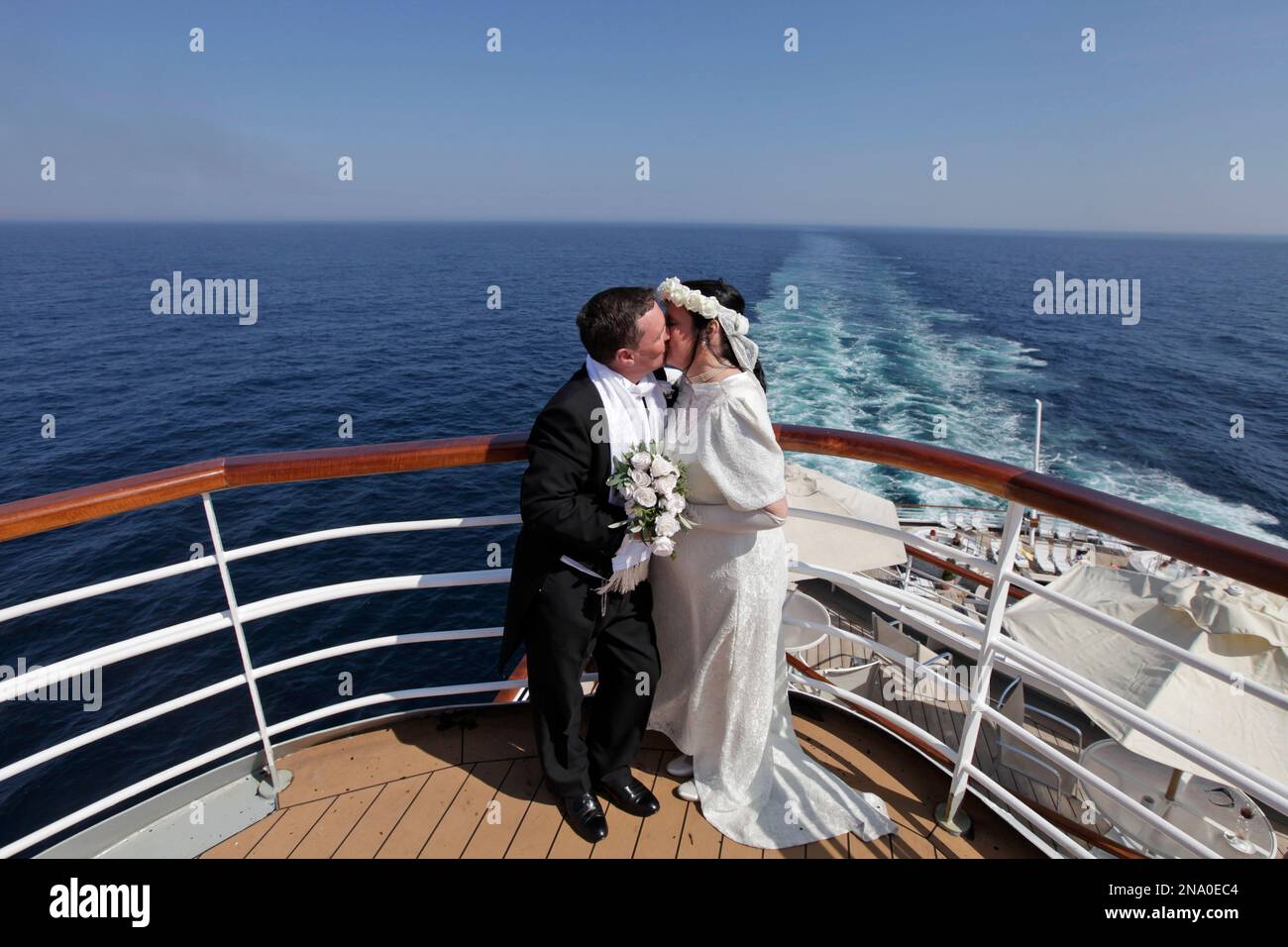 Derek Chambers and his wife Lynn, both from Belfast, kiss on the open ...