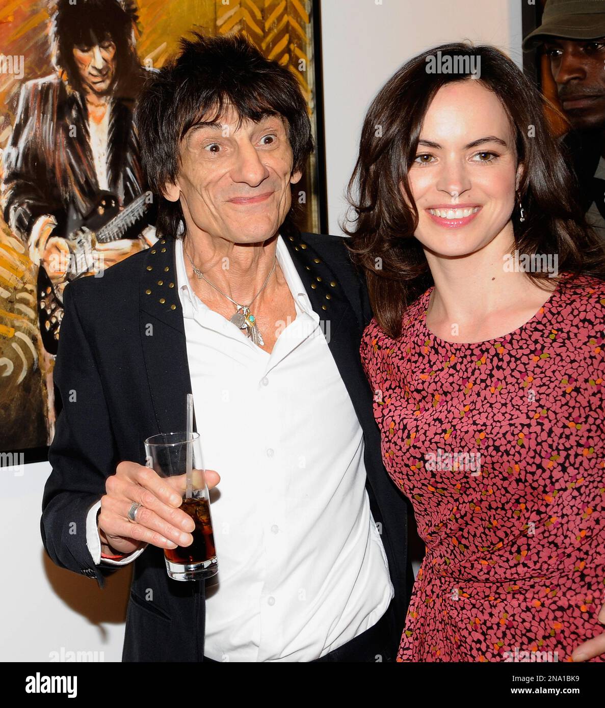 Rolling Stones guitarist Ronnie Wood poses with his girlfriend theatre ...