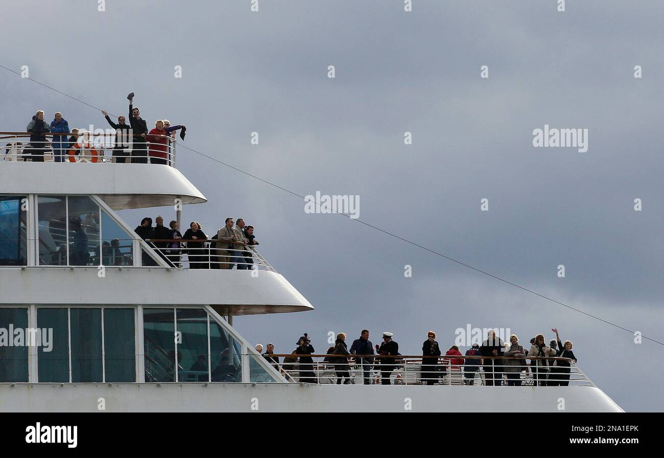 Passengers wave as the MS Balmoral sets sail for the Titanic memorial ...