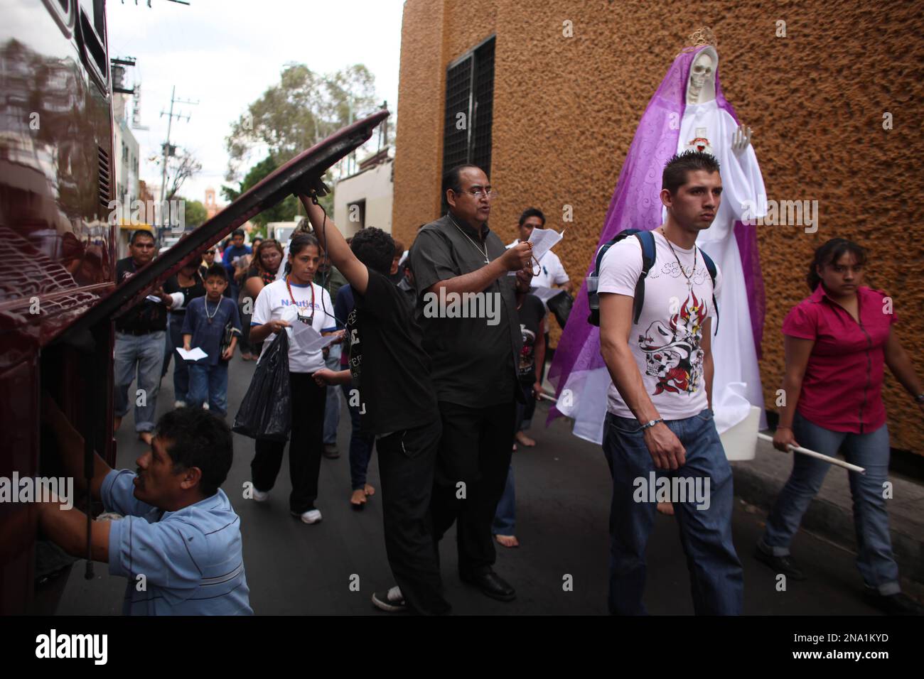 Worshipers carry an image of the folk saint known in Mexico as "Santa ...