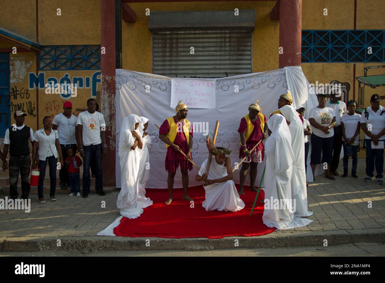 People take part in a reenactment of Jesus' crucifixion during Holy ...