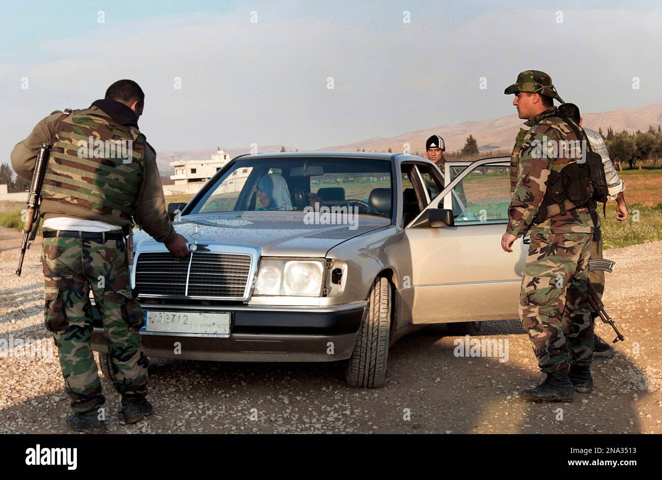 Lebanese army soldiers search a car during a raid, at the Lebanese ...