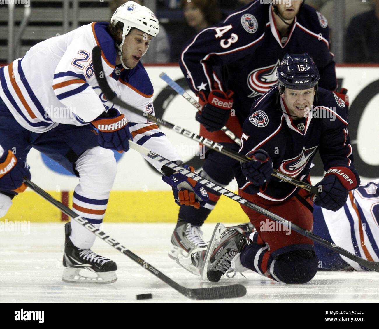 Edmonton Oilers' Ryan Jones, left, and Columbus Blue Jackets' Derek ...