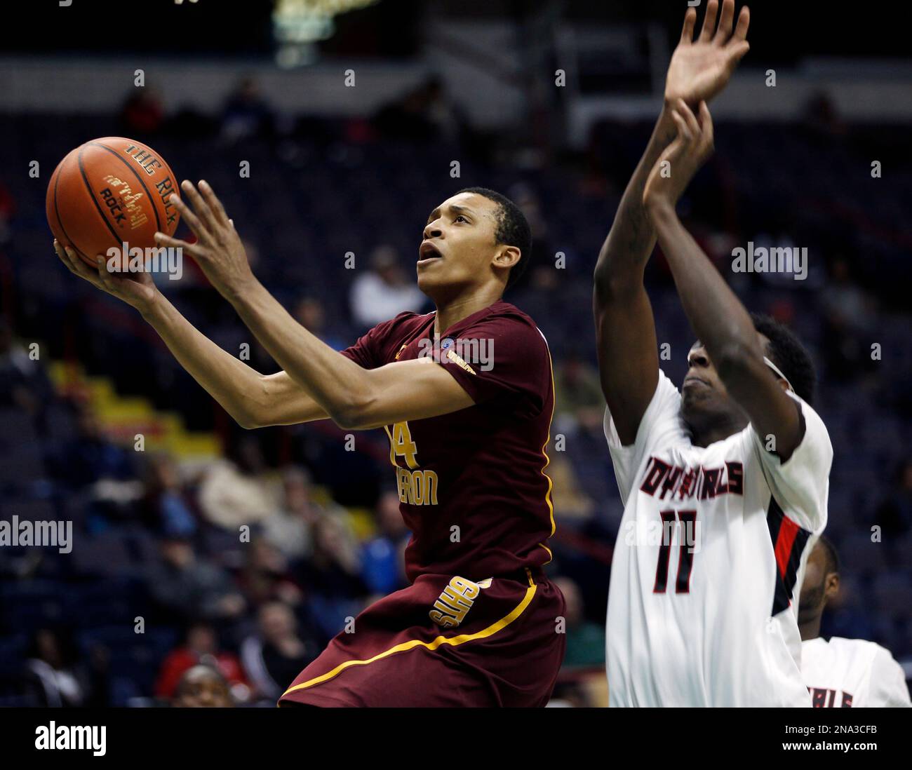 Mount Vernon's Randy Stevens, left, takes a shot in front of Boys and ...