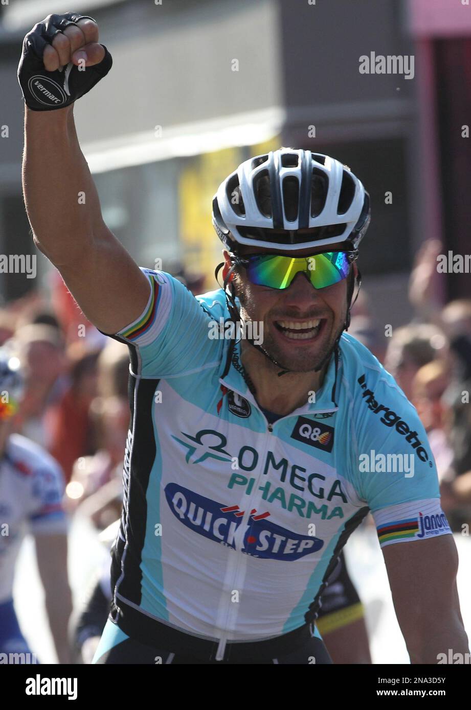 Belgium's Tom Boonen of the Omega Pharma-Quickstep team jubilates as he ...
