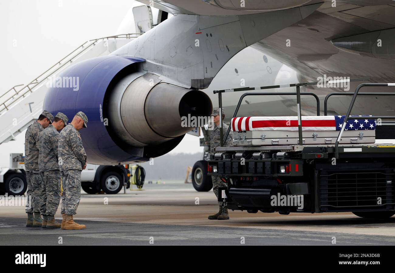 Chaplain Maj. Marty Fields, left, direct a prayer over the transfer ...