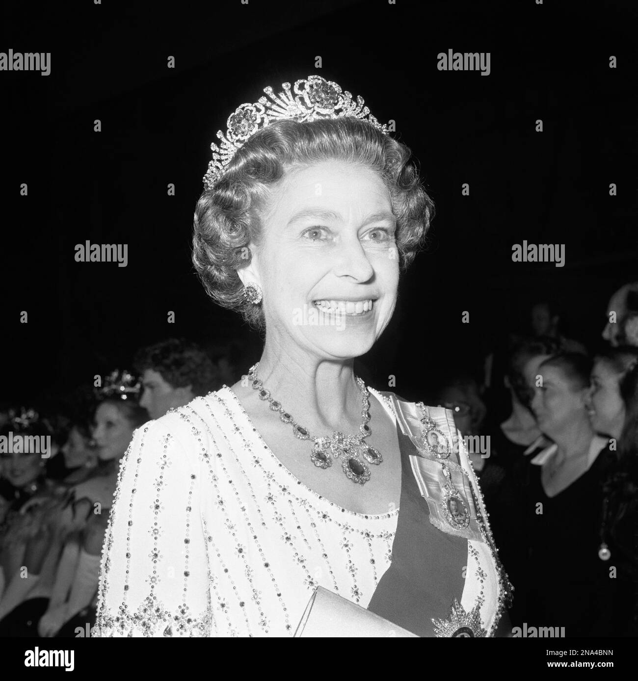 A smiling Queen Elizabeth II of Great Britain as she meets the cast ...