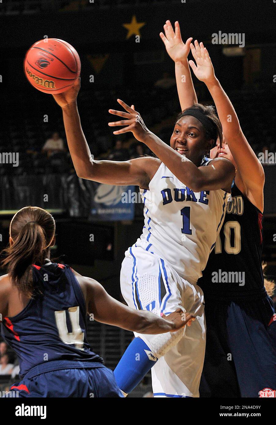 Duke center Elizabeth Williams (1) passes the ball under pressure from ...