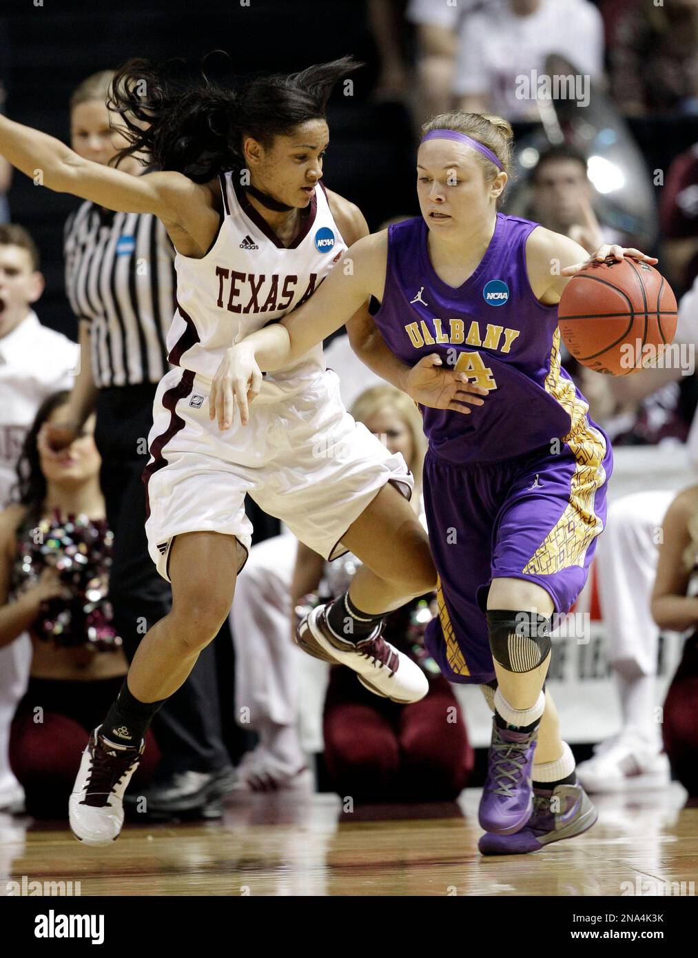 Albany's Sarah Royals (4) tries to drive around Texas A&M's Sydney ...