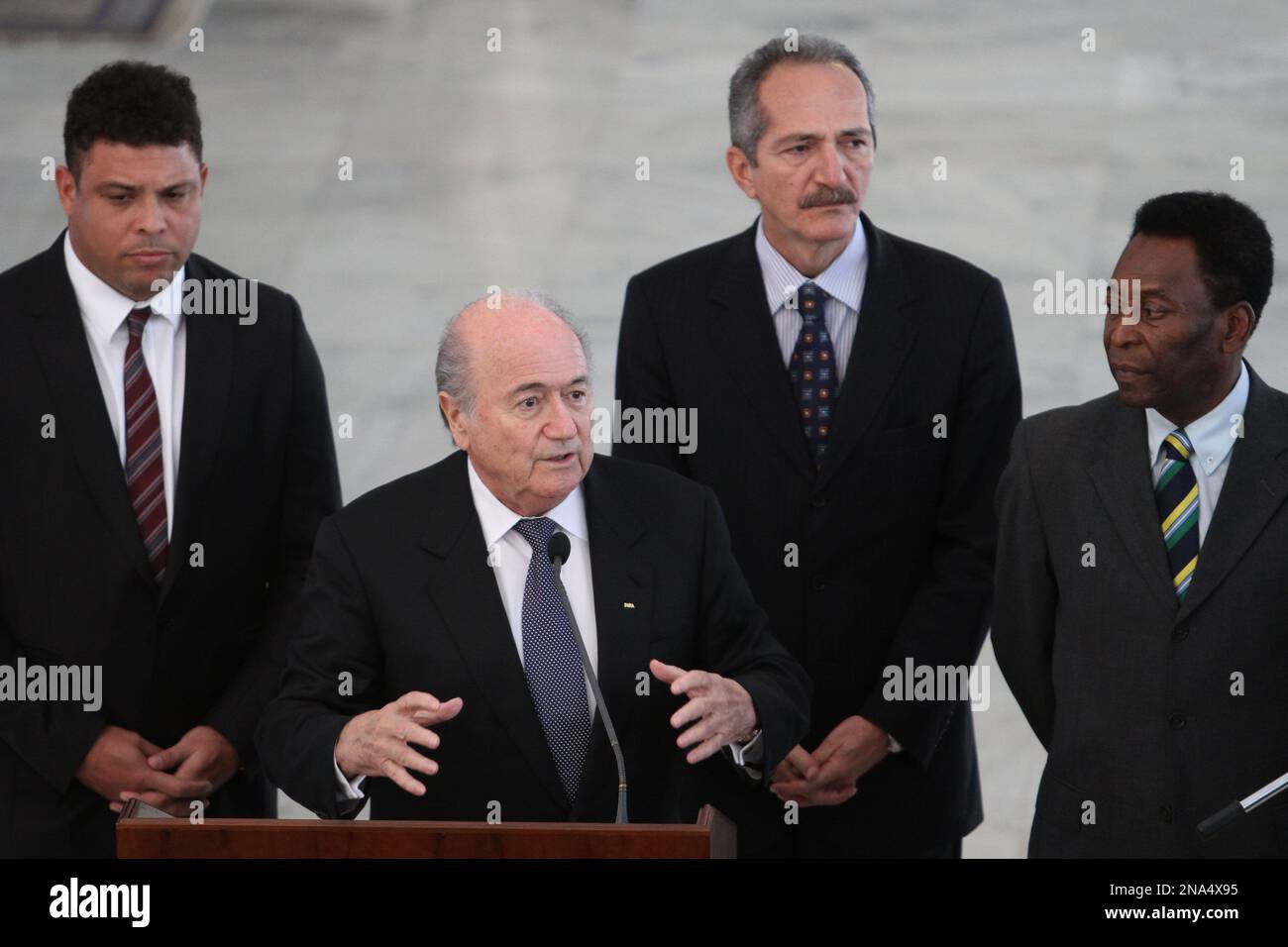 FIFA head Sepp Blatter, center, speaks to the press as Brazil’s Sports ...
