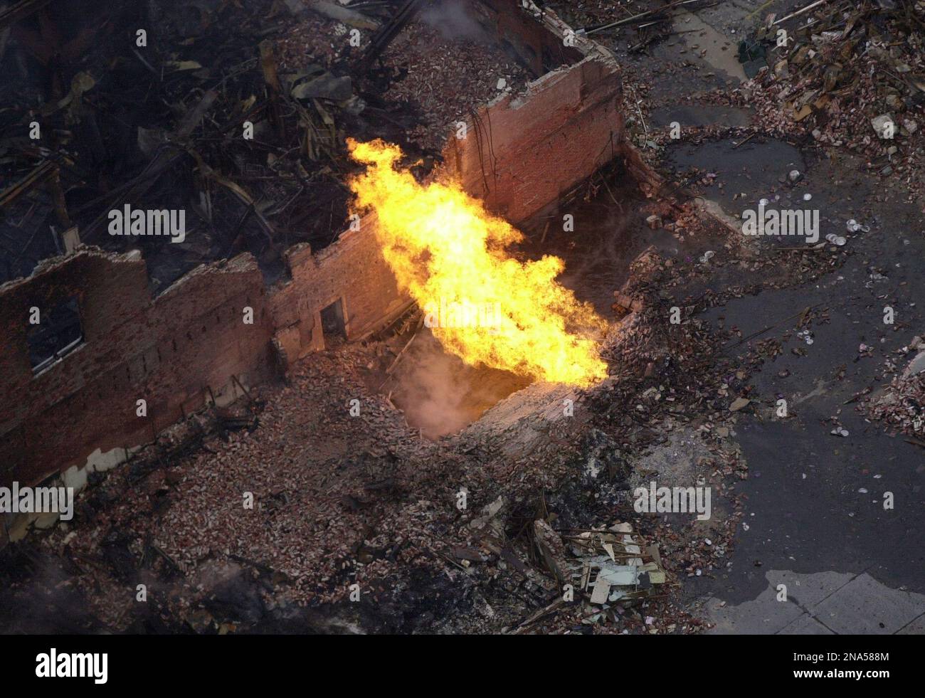 Huge flames still erupt from the ground in what was a wedding supply ...