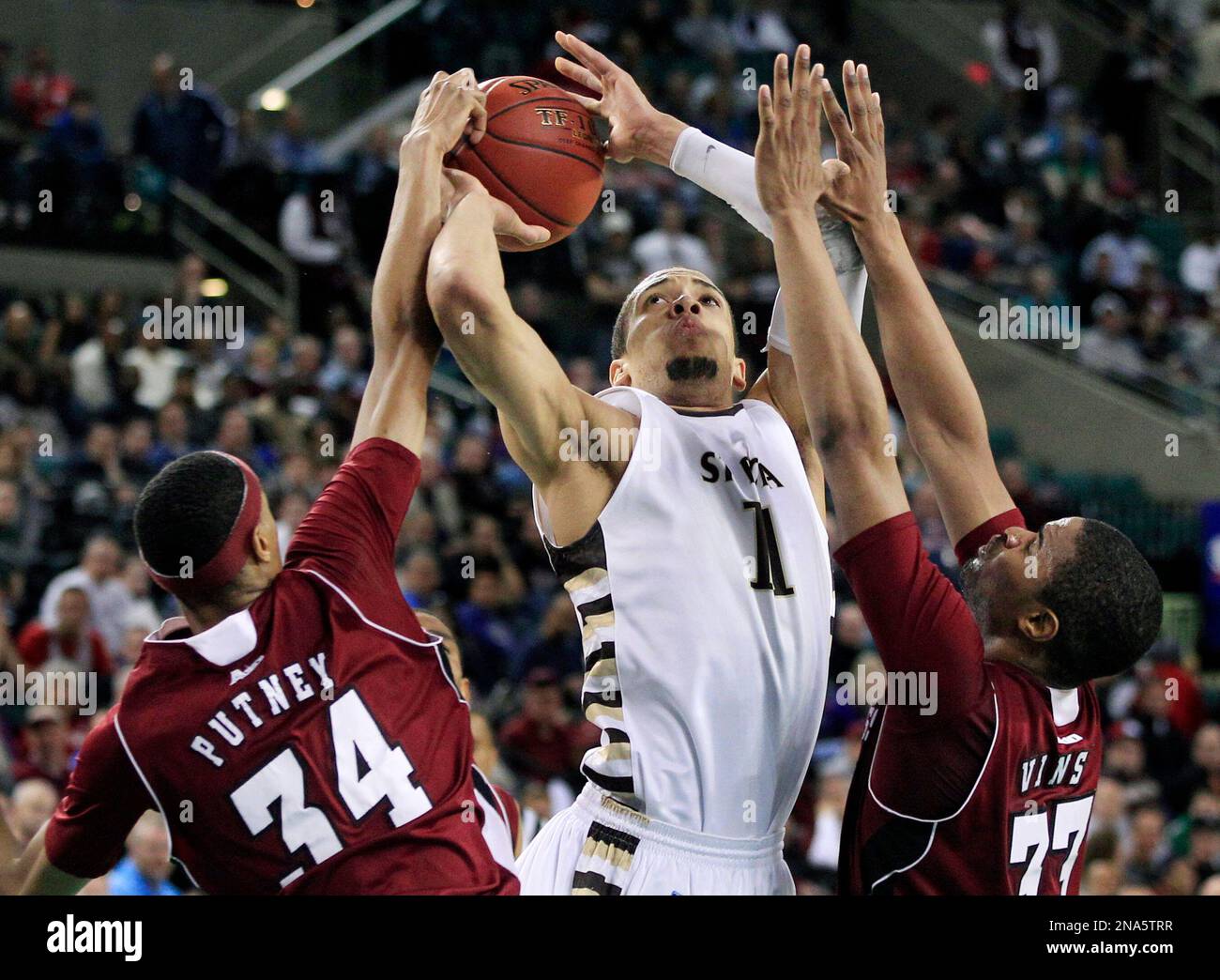 St. Bonaventure's Demetrius Conger (11) takes a shot past Massachusetts ...