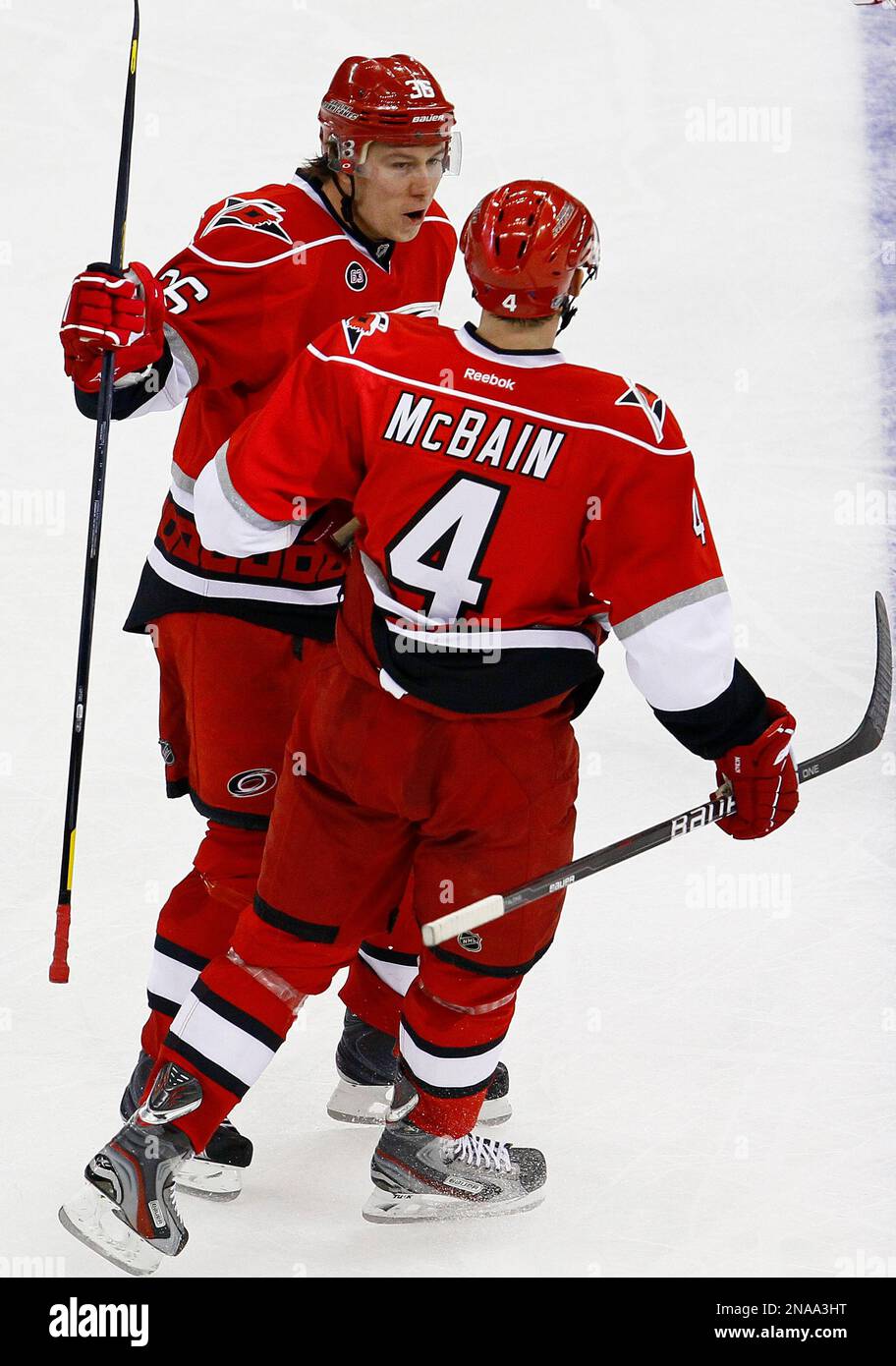 Carolina Hurricanes' Jussi Jokinen, left, of Finland, and Jamie McBain ...