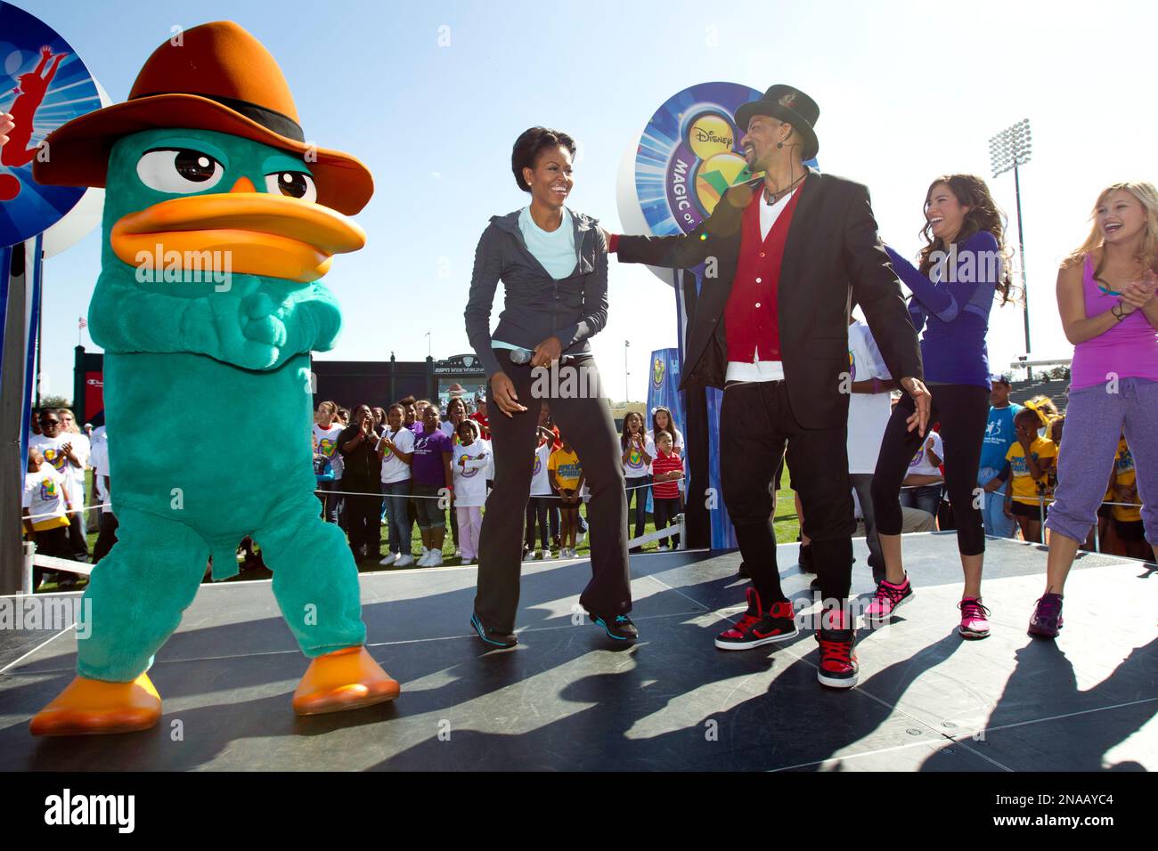 First lady Michelle Obama dances the platypus dance with Perry the ...