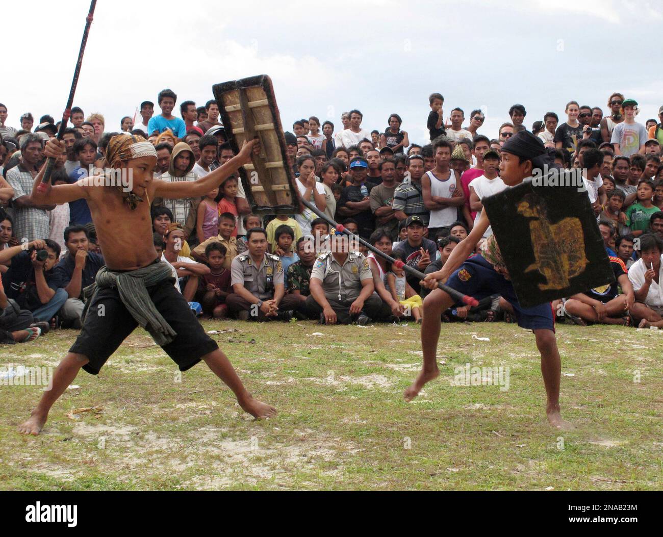 In this Thursday, Feb. 9, 2012 photo two young boys battle in the ...