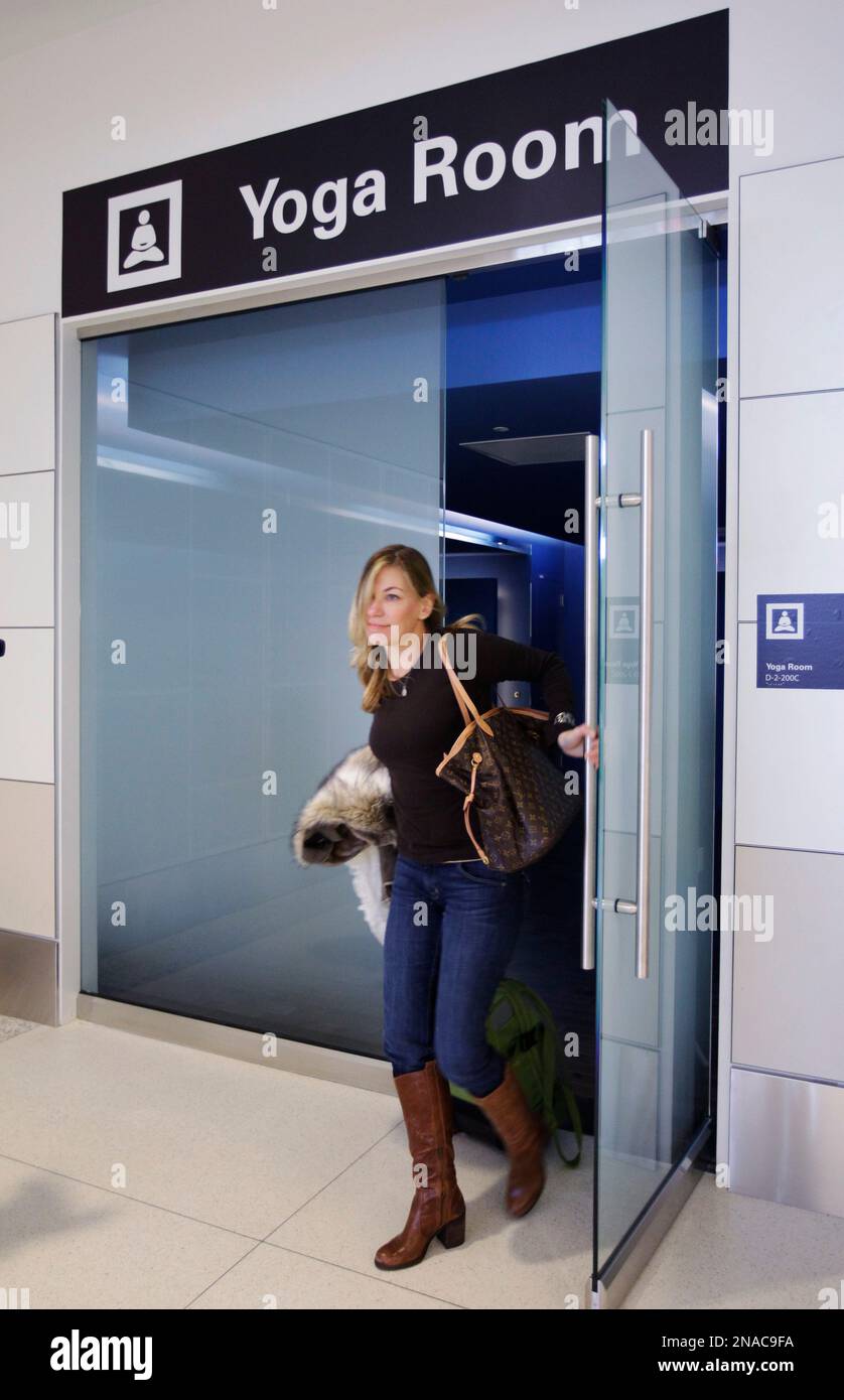 In this Friday, Jan. 27, 2012 photo, traveler Maria Poole leaves San ...