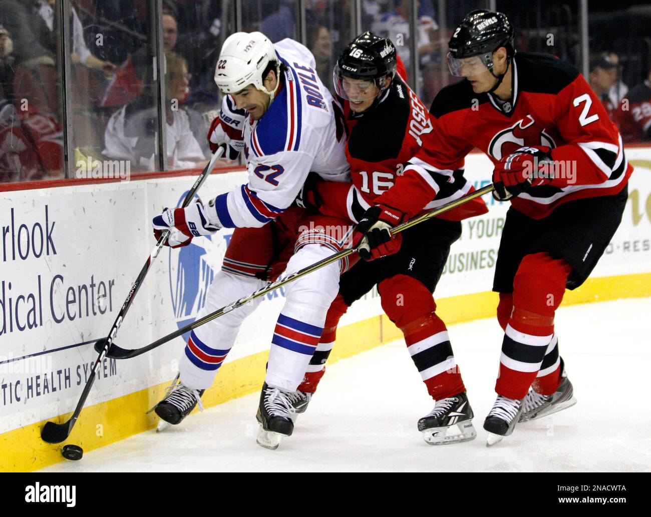 New York Rangers' Brian Boyle (22) competes for the puck against New ...