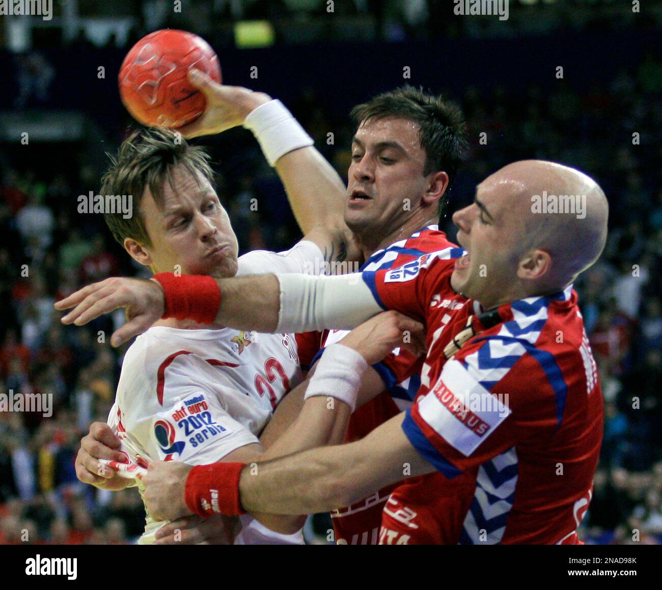 Denmark's Kasper Sondergaard Sarup, left, competes against Serbia's ...