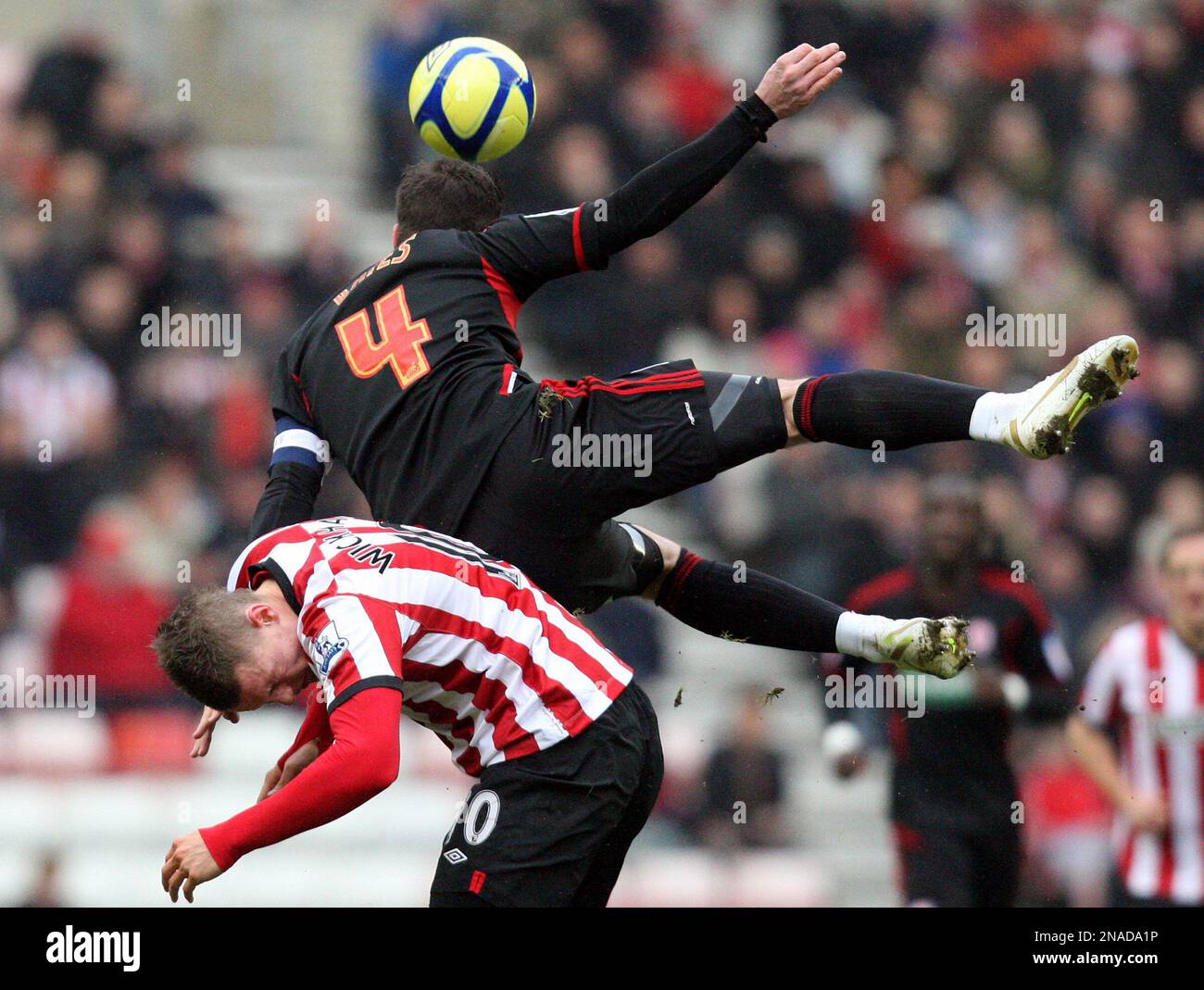Sunderland's Connor Wickham, bottom, vies for the the ball with ...