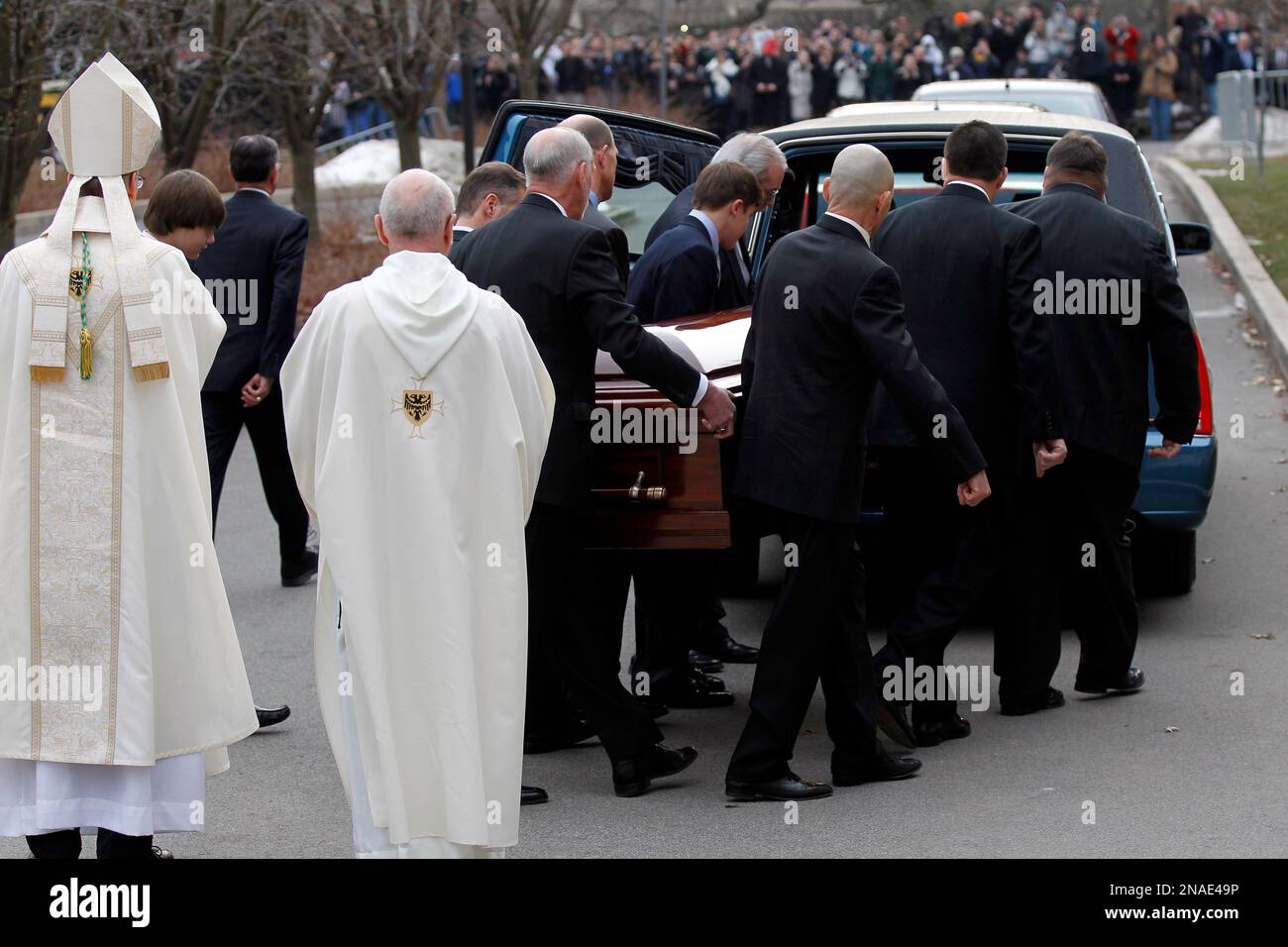 Pallbearers including sons Jay Paterno, and Scott Paterno, carry the ...