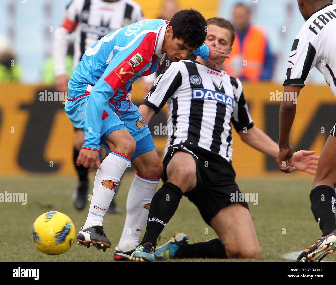 Catania's Pablo Barrientos, left, of Argentina, and Udinese's Almen ...
