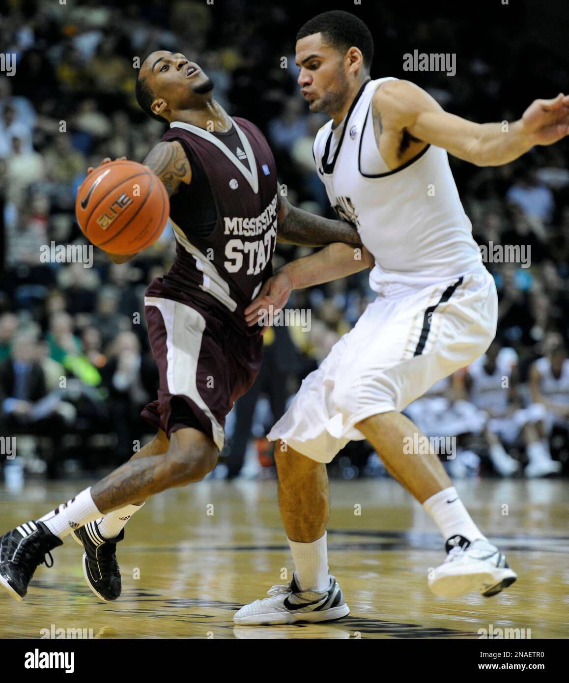 Mississippi State guard Dee Bost (3) tries to power past Vanderbilt ...