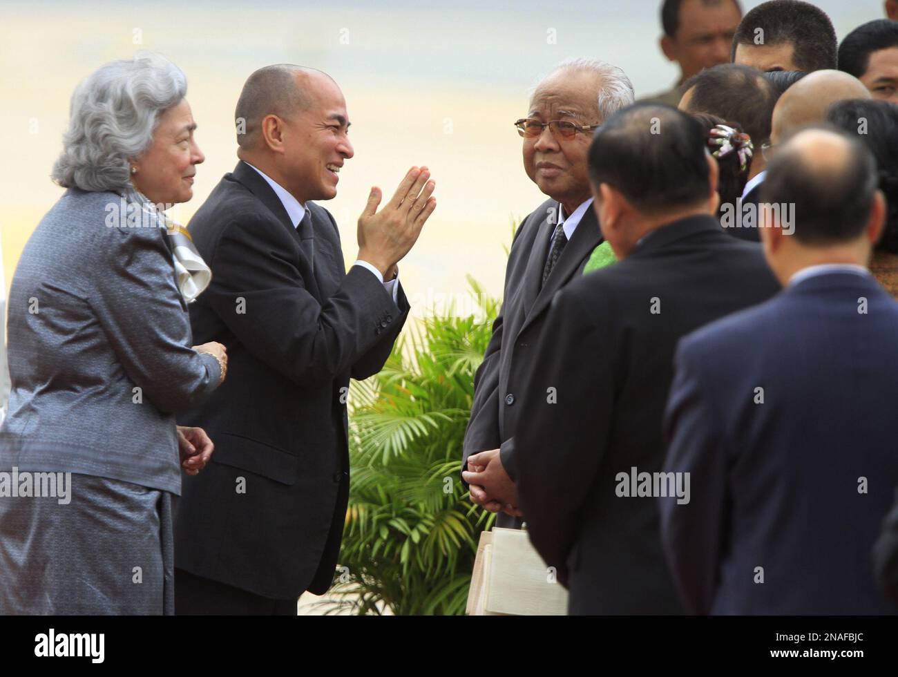 Cambodia's King Norodom Sihamoni, second left, accompanied by his ...