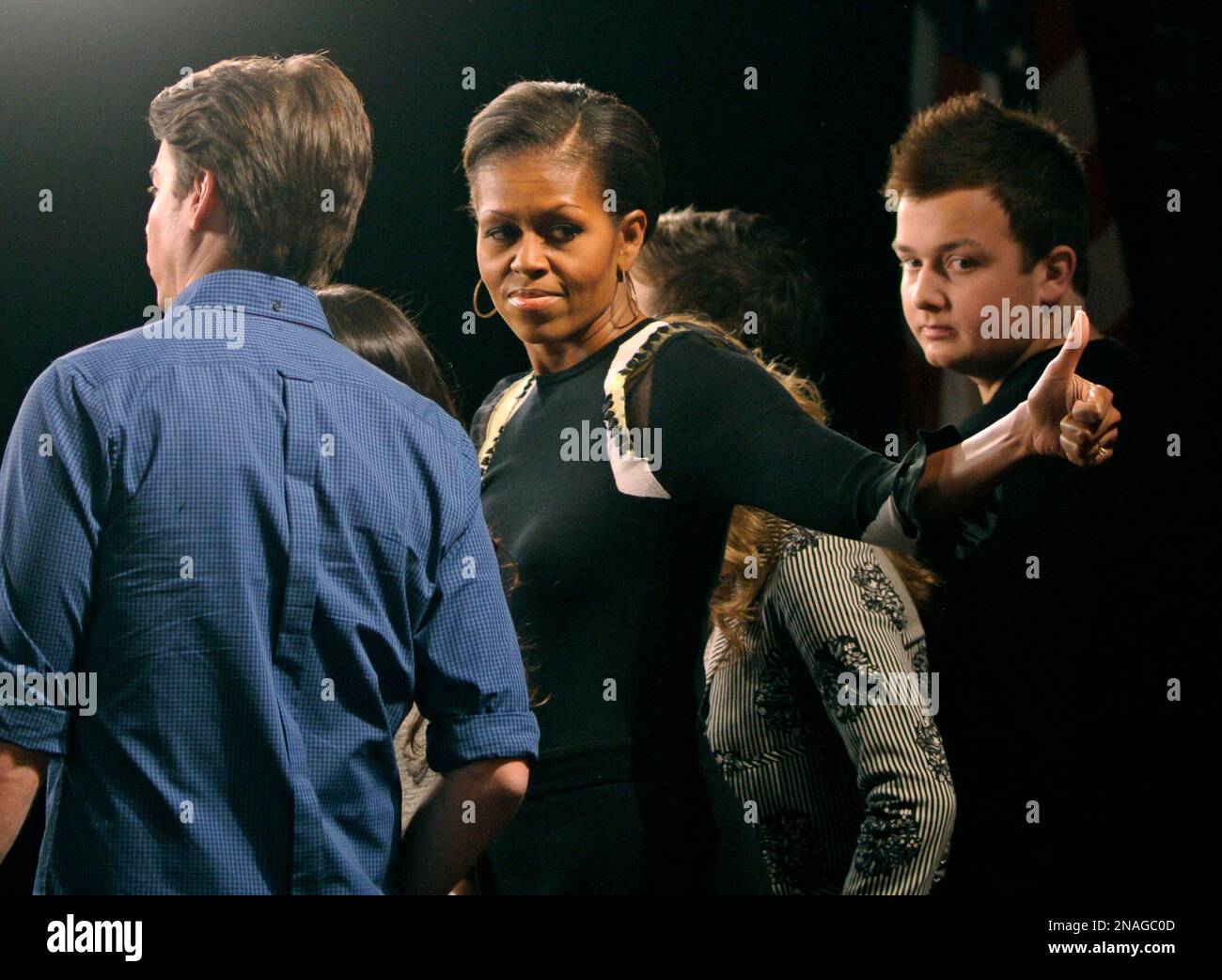 First lady Michelle Obama gives a thumbs-up to students as she joins ...