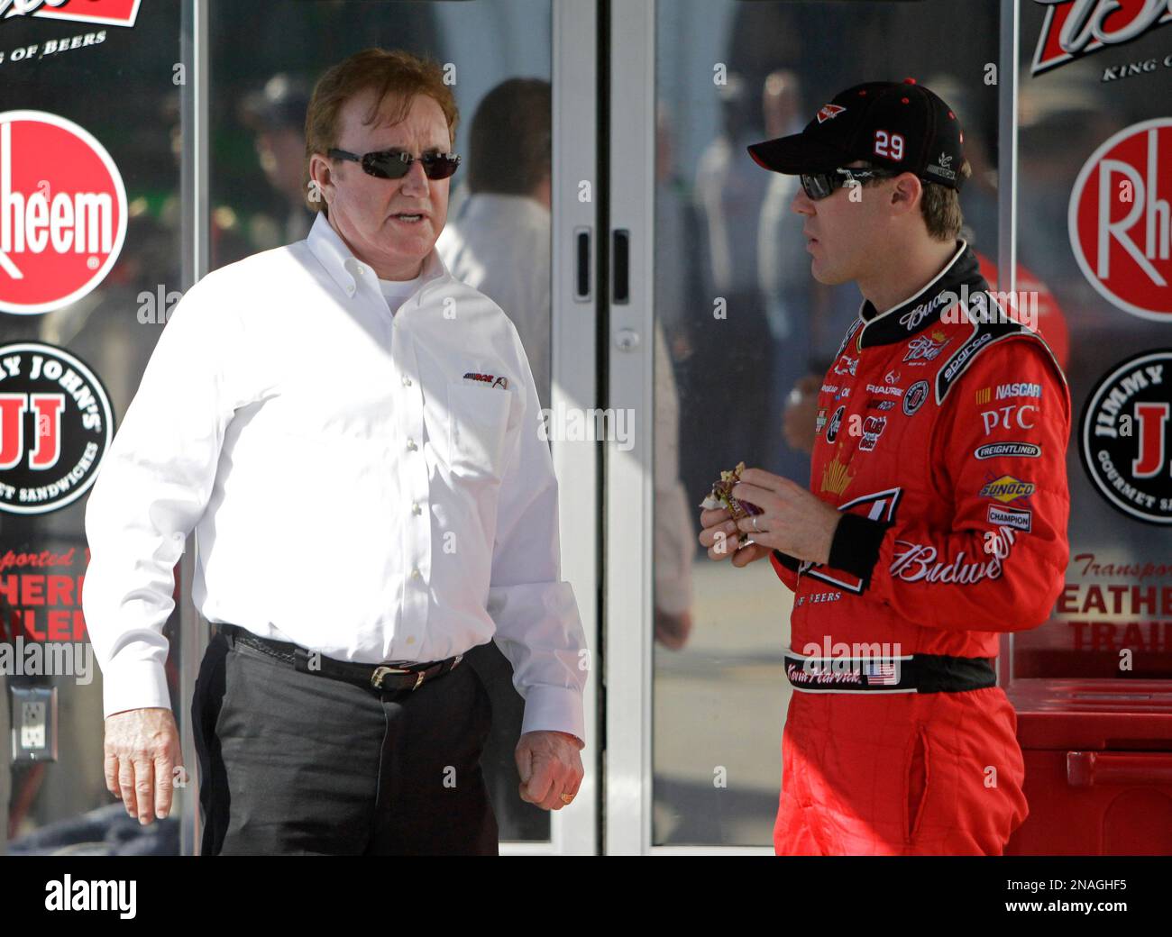 Car owner Richard Childress, left, talks with NASCAR driver Kevin ...