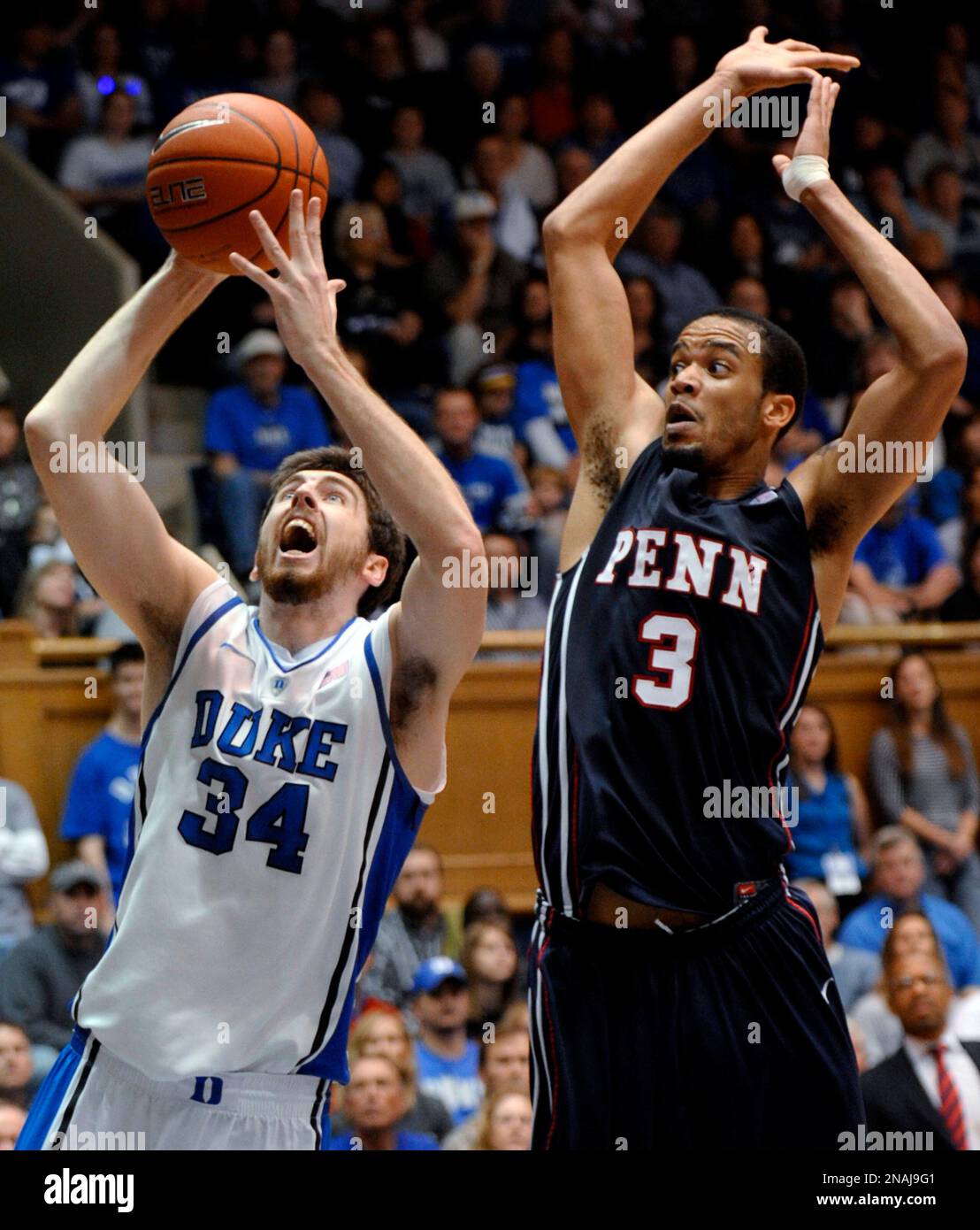 Duke's Ryan Kelly (34) drives toward the basket, avoiding Pennsylvania ...