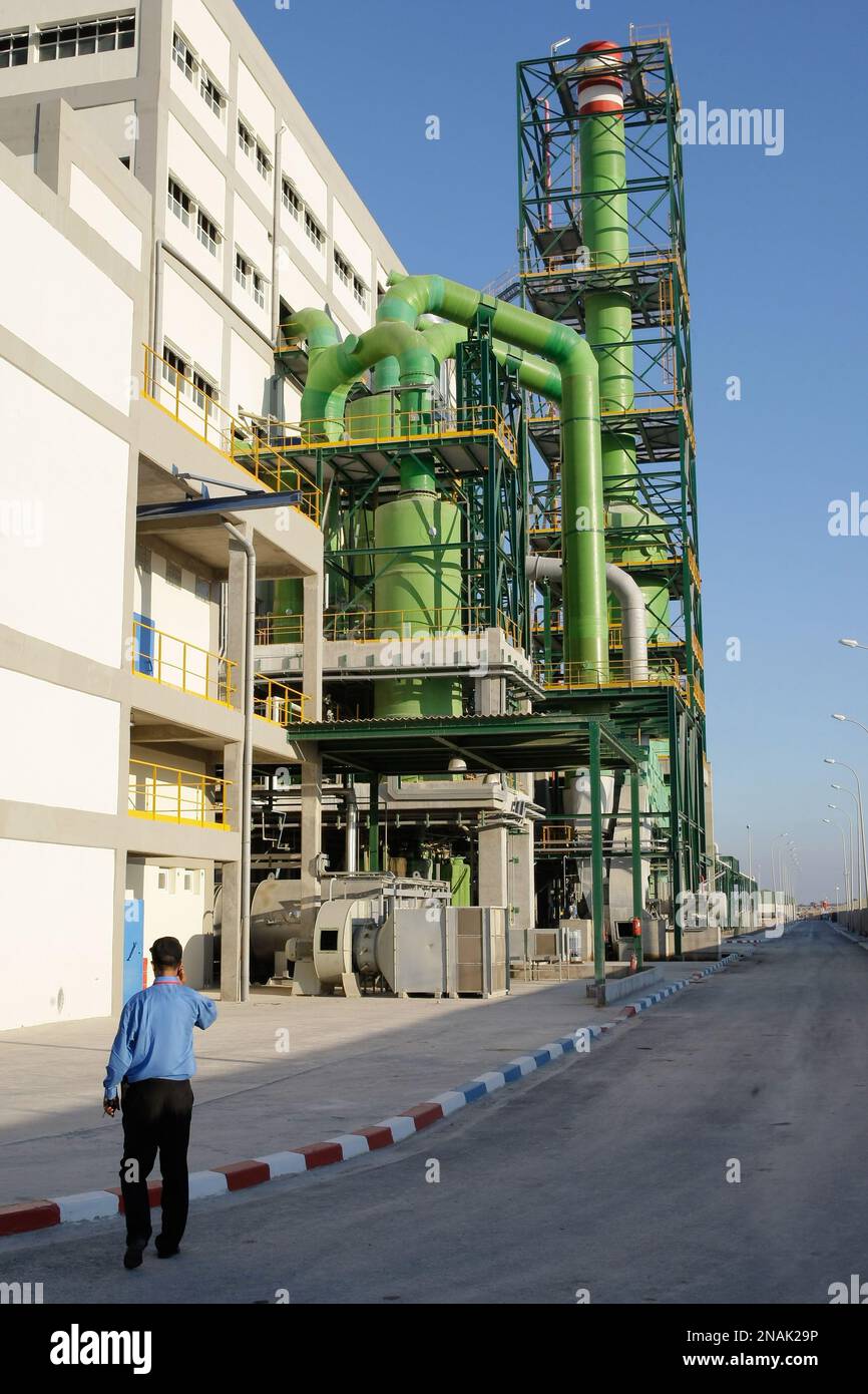 A Moroccan worker walks at the industrial unit of a new production of ...